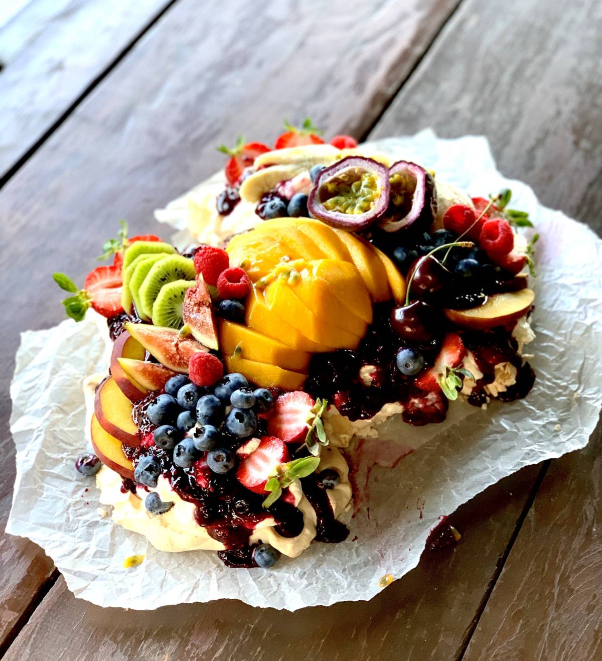 Pavlova with Berry Coulis, Anzac Biscuit Crust and Macadamia ...