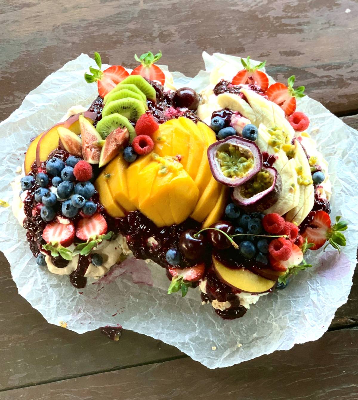 Pavlova with Berry Coulis, Anzac Biscuit Crust and Macadamia ...